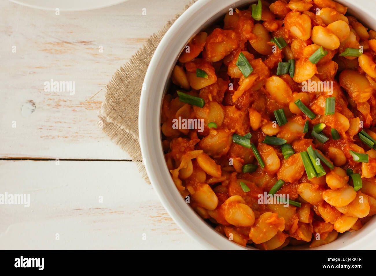 Baked lima beans in white pan selective focus Stock Photo - Alamy