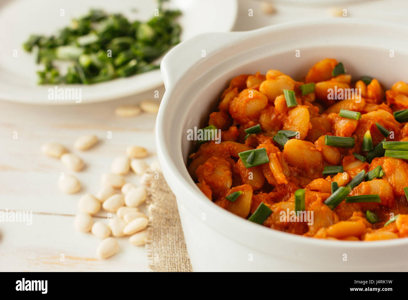 Baked lima beans in white pan selective focus Stock Photo - Alamy
