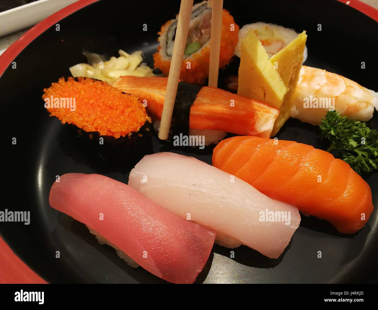 Hand using chopsticks hi-res stock photography and images - Alamy