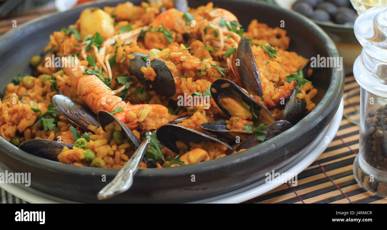 Close up view of delicious Spanish seafood paella: mussels, king prawns ...