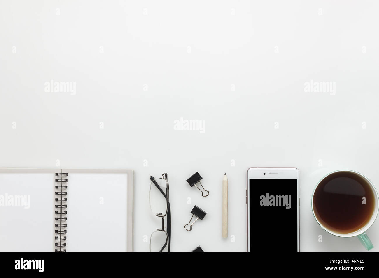 Top view accessories office desk concept.mobile phone,coffee,notepaper ...