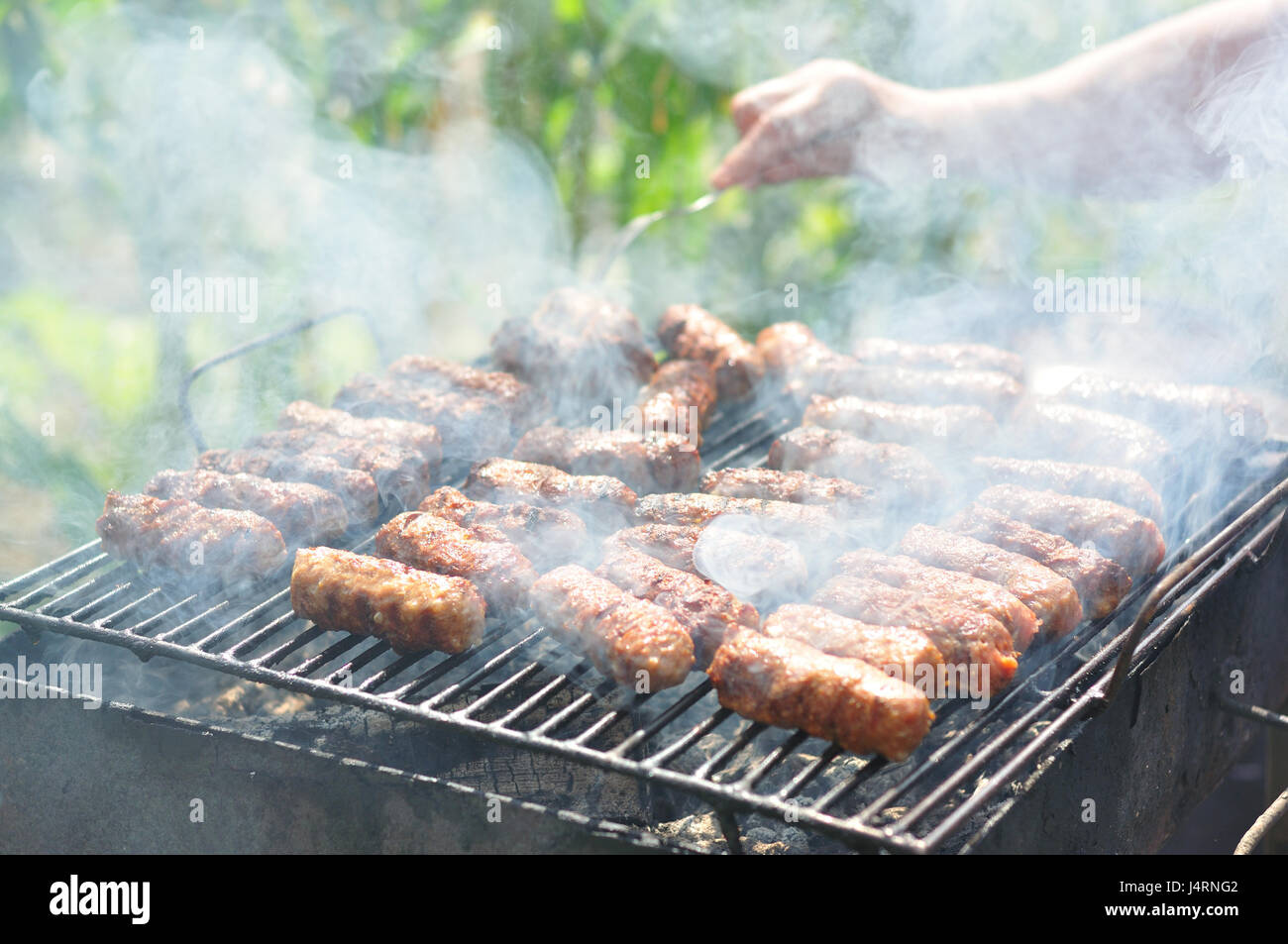 Traditional Romanian food, grilled meat rolls known as mititei Stock ...