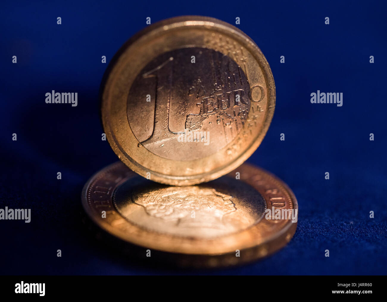 One euro coin on banknote Stock Photo - Alamy
