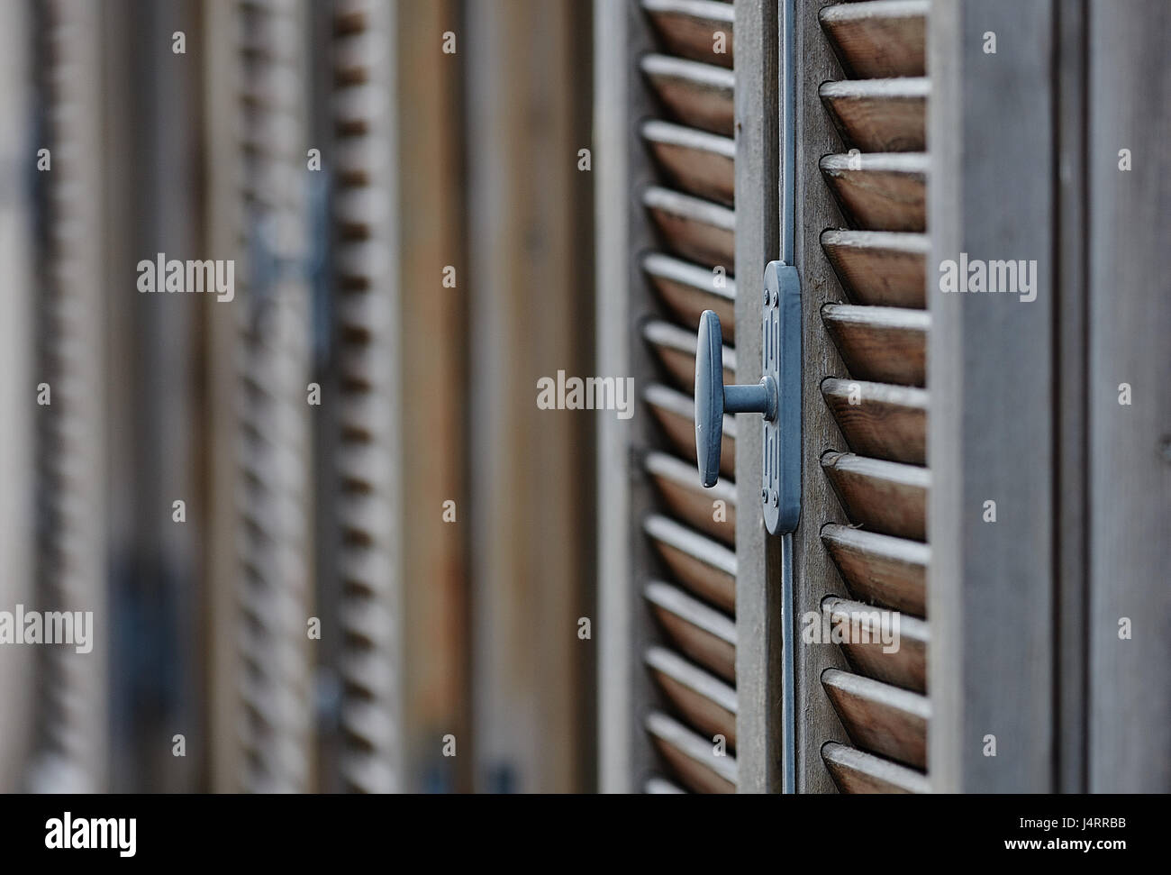 Windows shutter handle blurred close up photo Stock Photo - Alamy