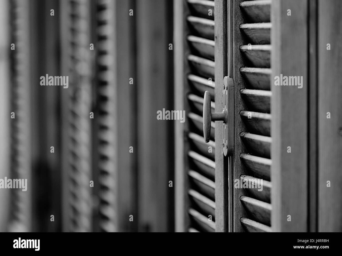 Windows shutter handle blurred close up photo Stock Photo - Alamy