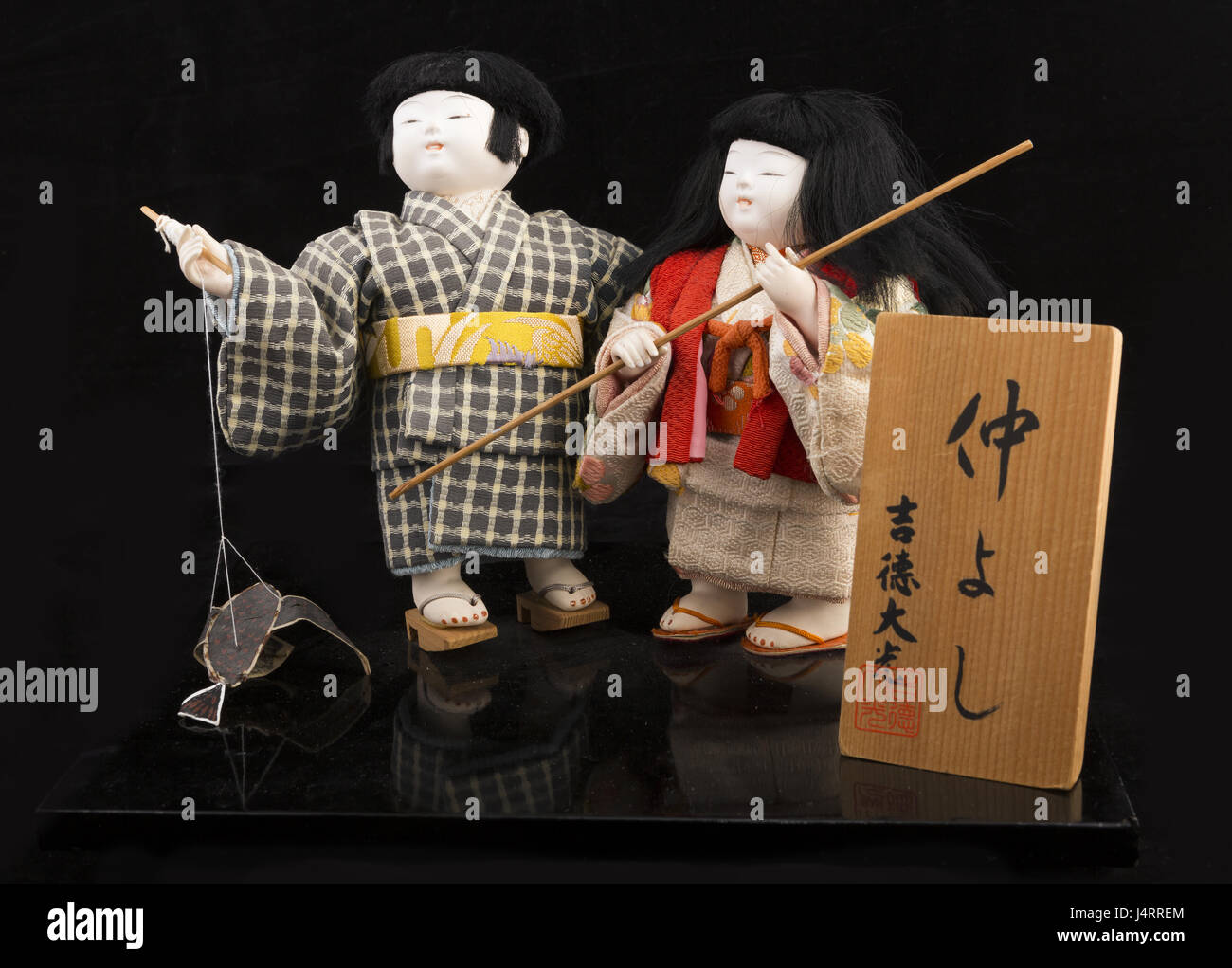 Japanese festive wooden doll Stock Photo - Alamy
