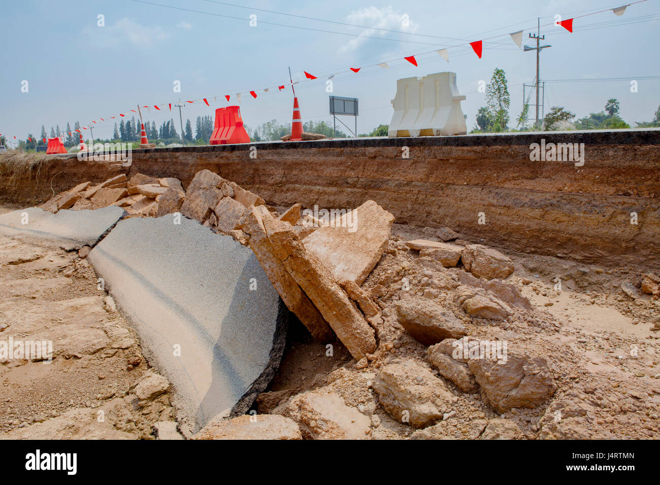 disaster of highway road after flood water in thailand Stock Photo - Alamy