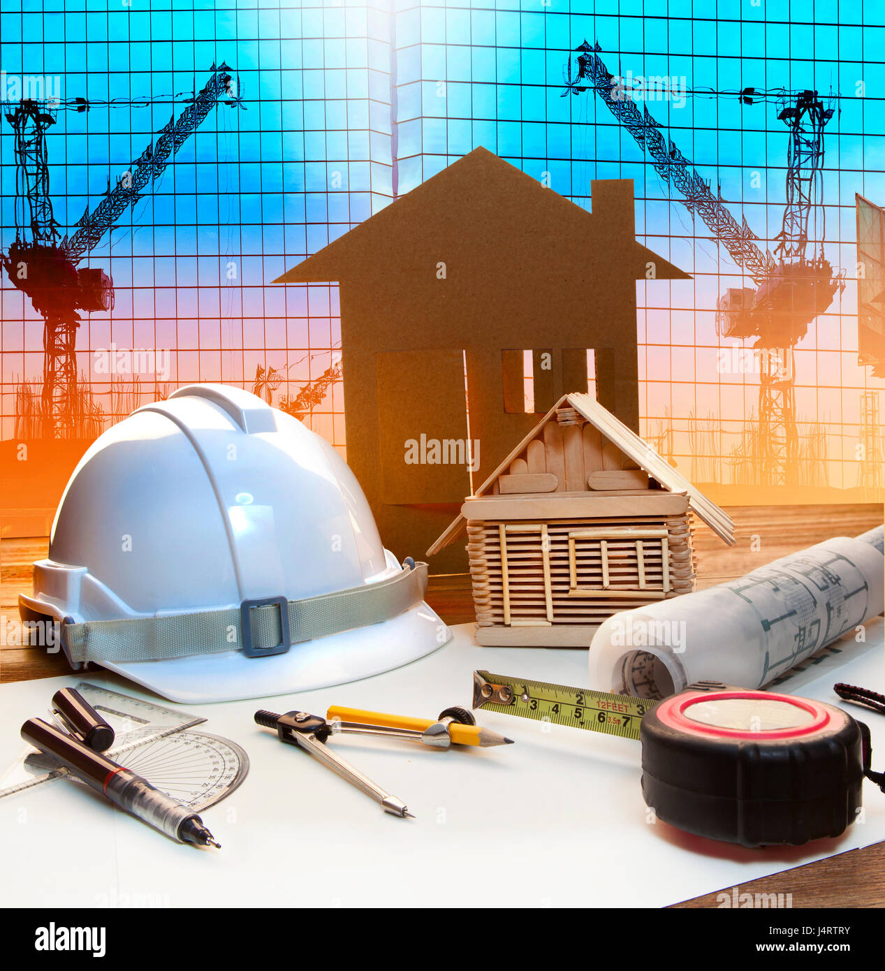 office tower and home construction plan on architect working table with ...