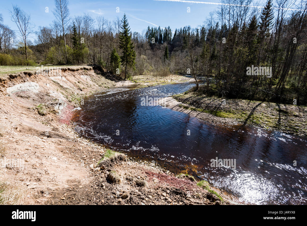 scenic spring colored river in country with trees and reflections Stock ...