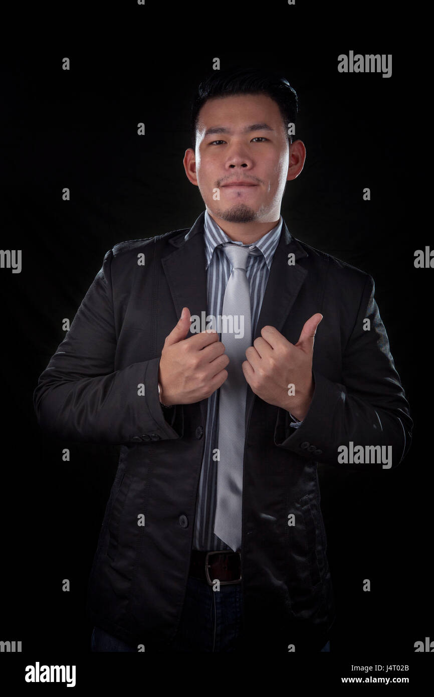 portrait of younger asian business man good working hand sign with ...