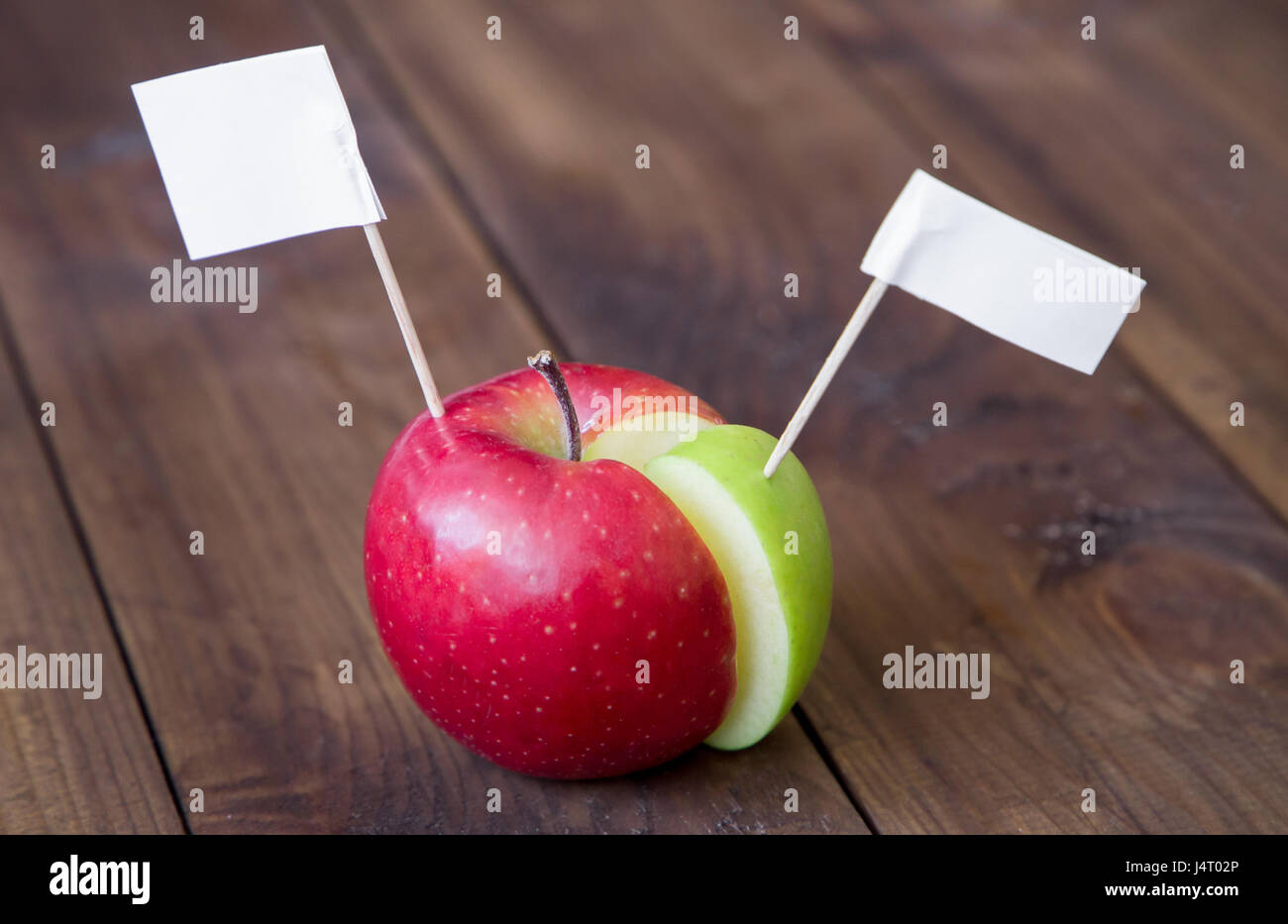 white flags thumbtack on chart made from apple. creative business ...
