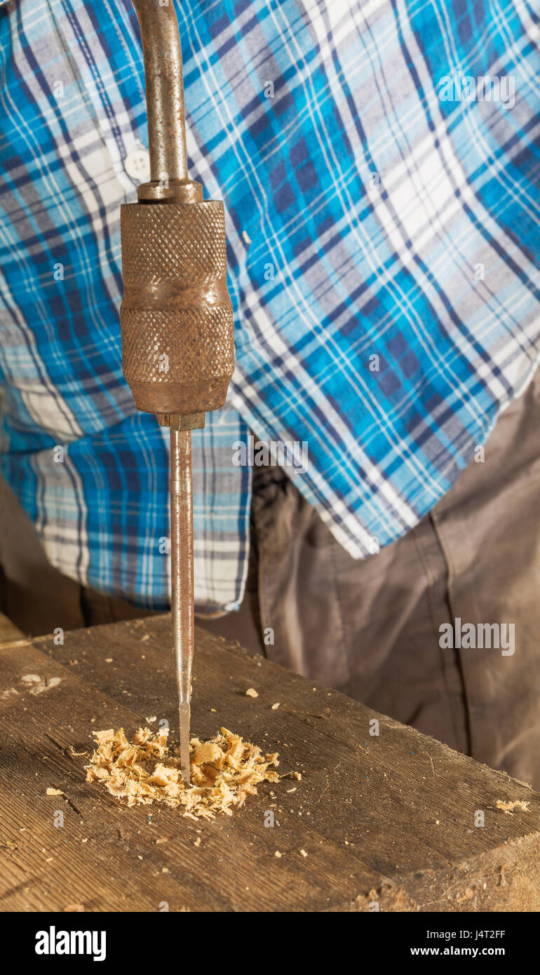Close up view of drilling process by the hand drill Stock Photo - Alamy
