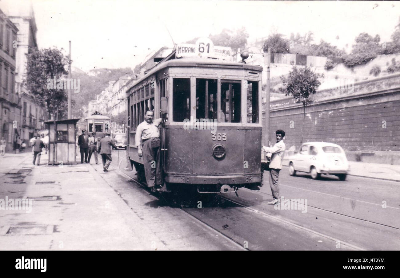 The image features a historic tram from the Tranvia Capodimonte system ...