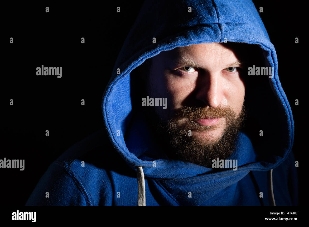 Low key portrait hooded hi-res stock photography and images - Alamy