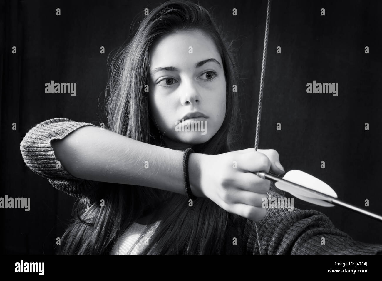 Beautiful woman aiming bow arrow hi-res stock photography and images ...