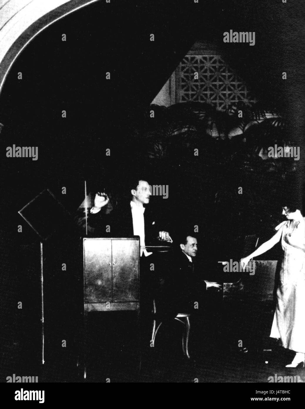 A retouched photograph featuring a trio of musicians performing with ...