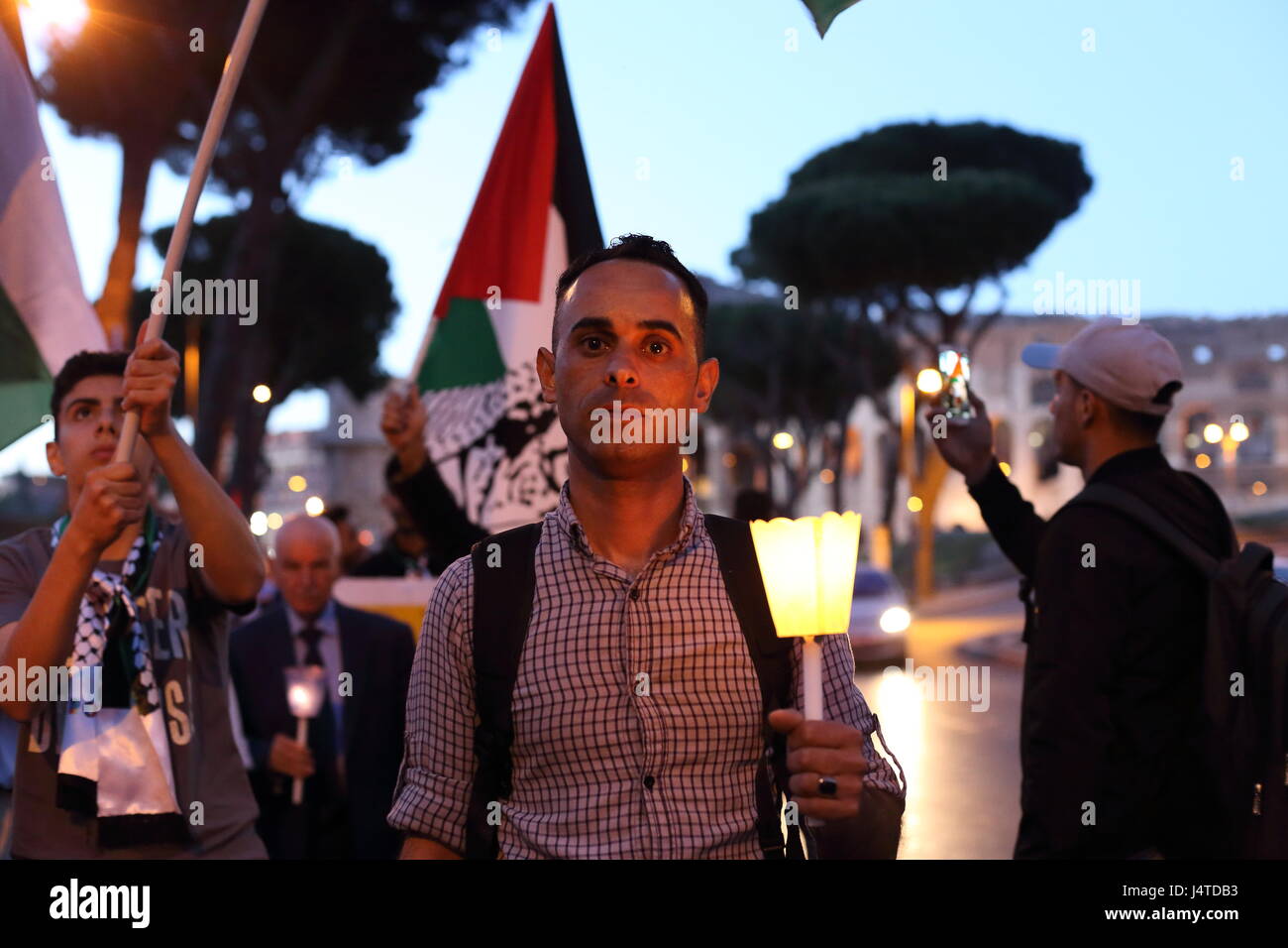 Torch lighting in front of the coliseum in Rome in solidarity with the ...