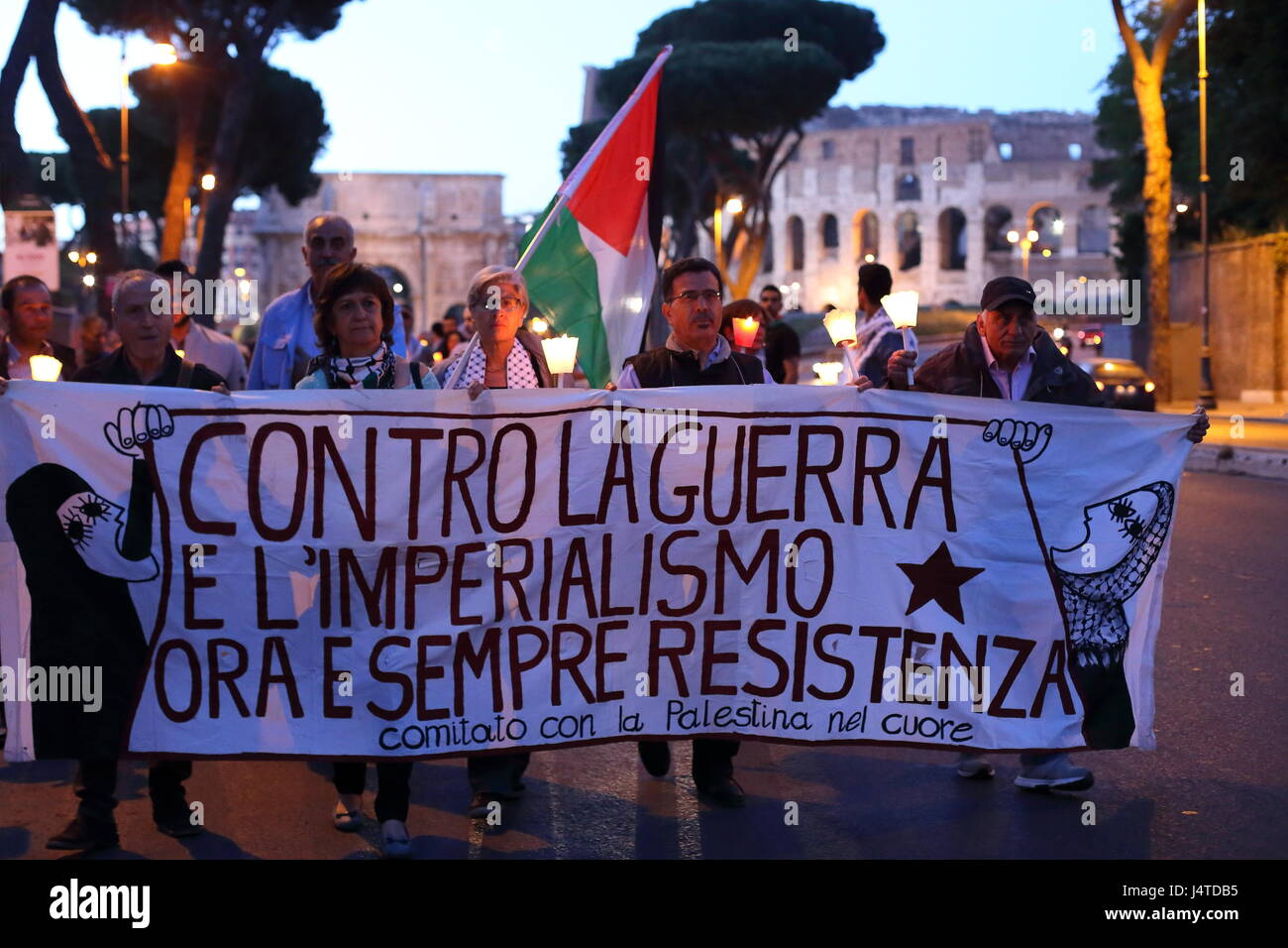 Torch lighting in front of the coliseum in Rome in solidarity with the ...