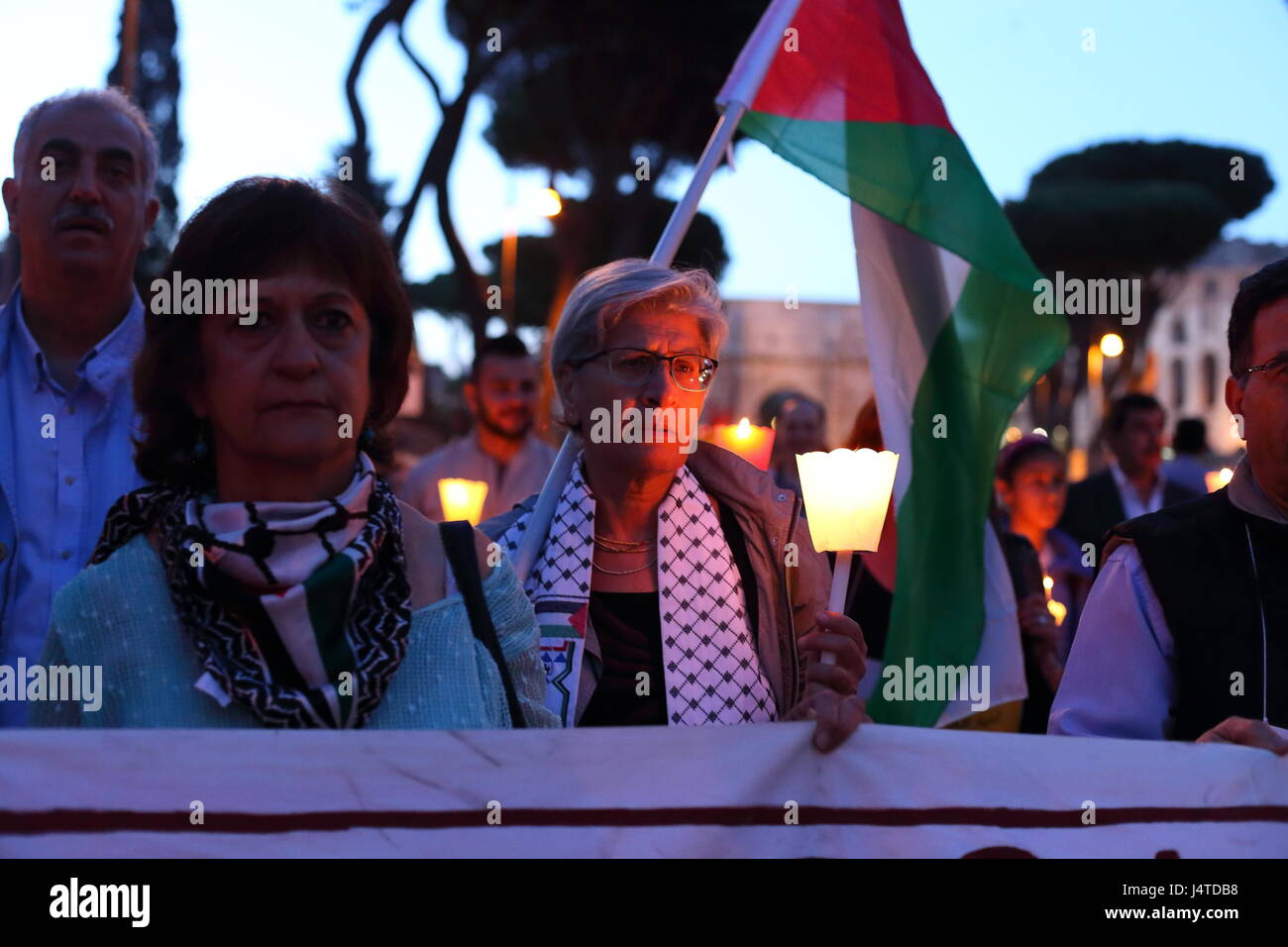 Torch lighting in front of the coliseum in Rome in solidarity with the ...