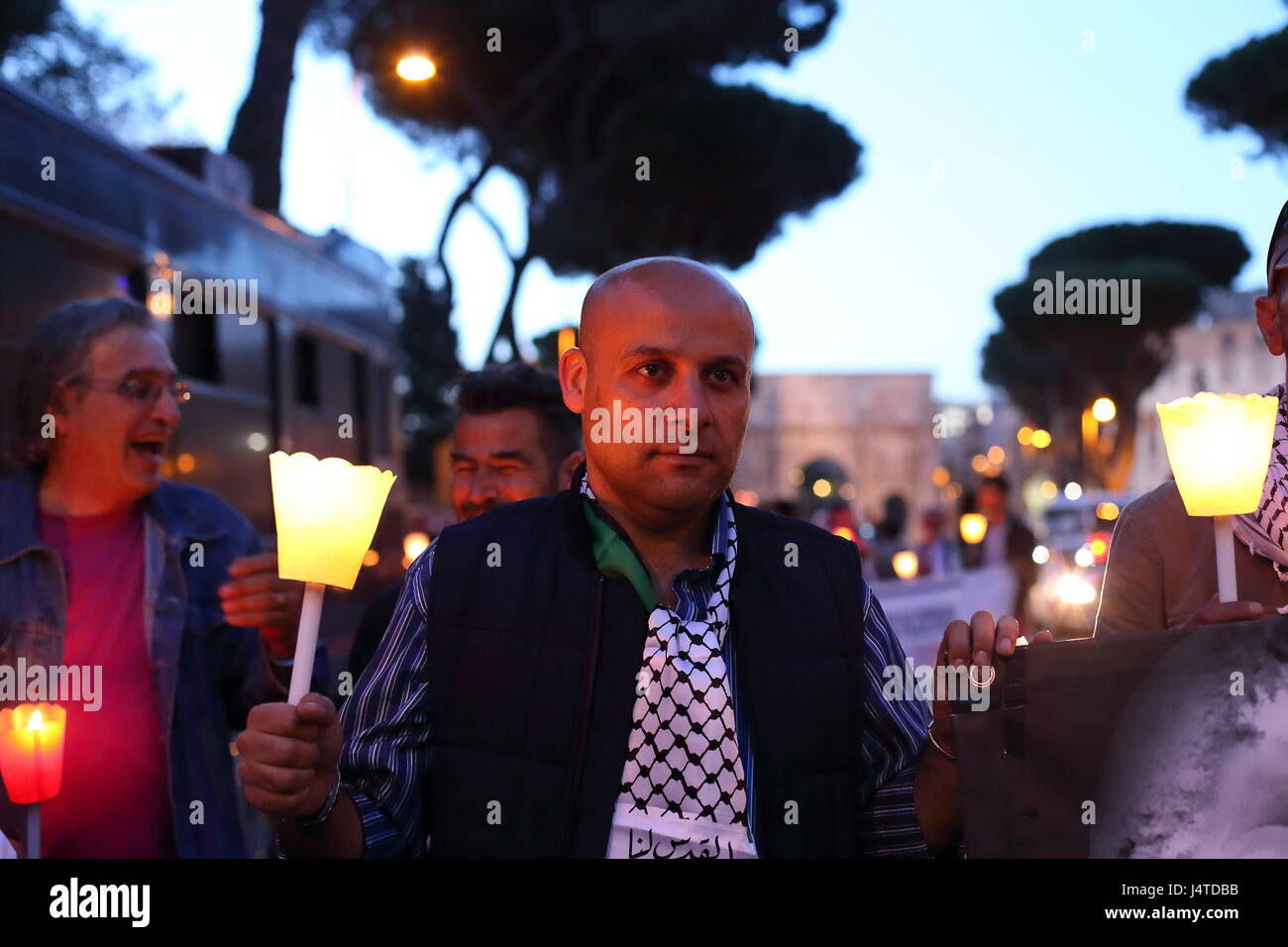 Torch lighting in front of the coliseum in Rome in solidarity with the ...