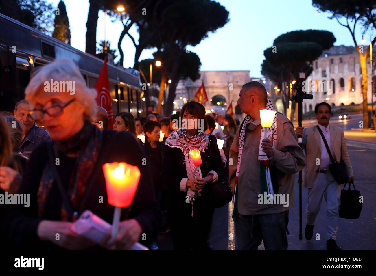 Torch lighting in front of the coliseum in Rome in solidarity with the ...