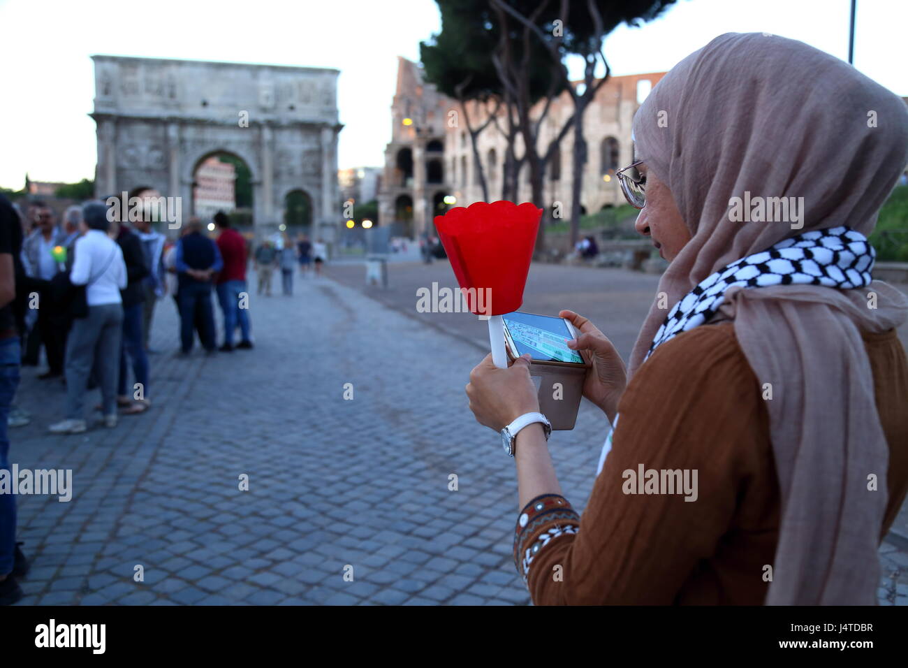 Torch lighting in front of the coliseum in Rome in solidarity with the ...