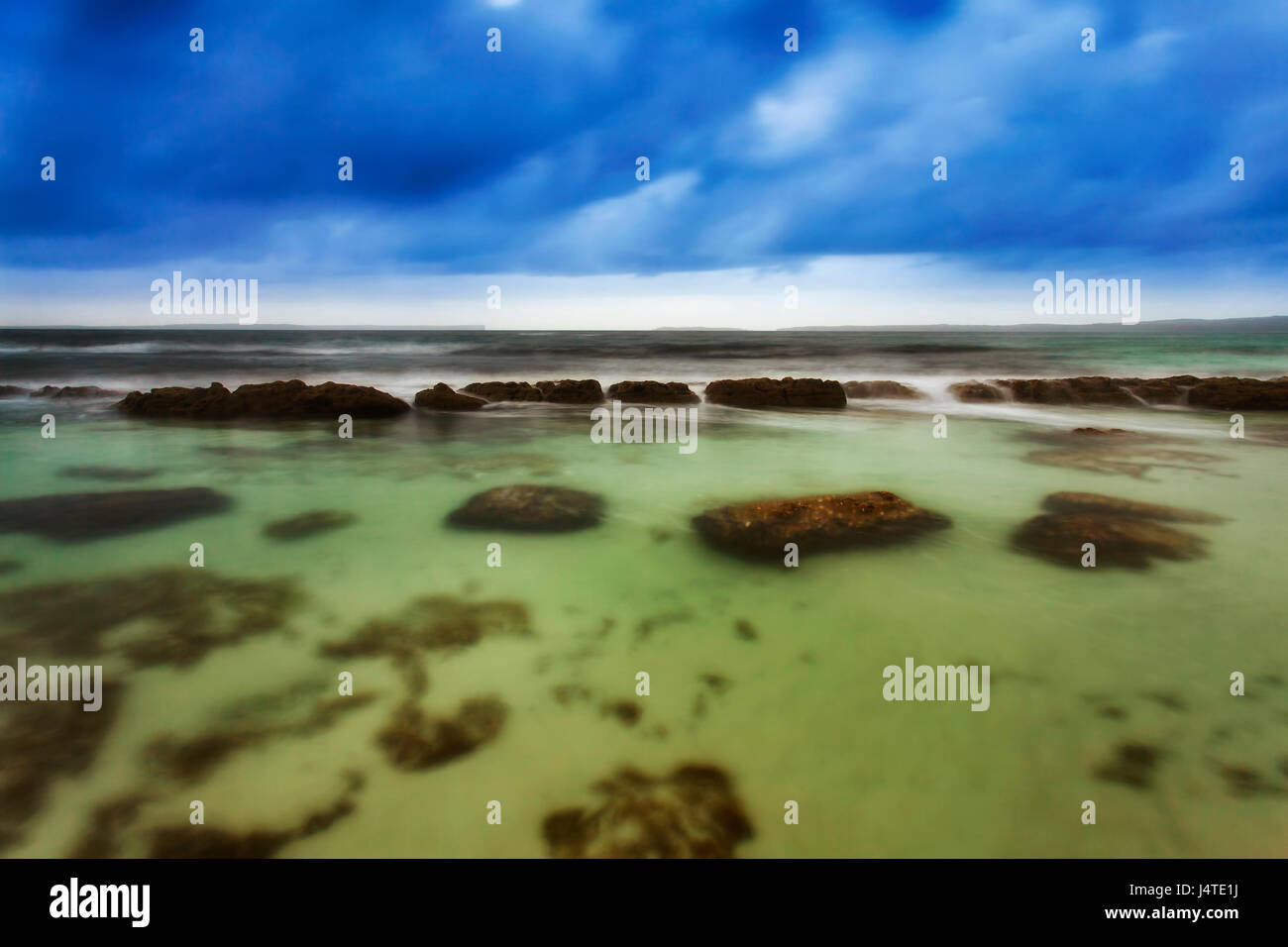 Natural shallow rock pool with clean salt water of Pacific ocean in ...