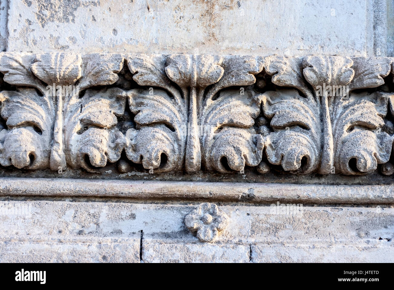 stone curving on vintage wall as background Stock Photo - Alamy