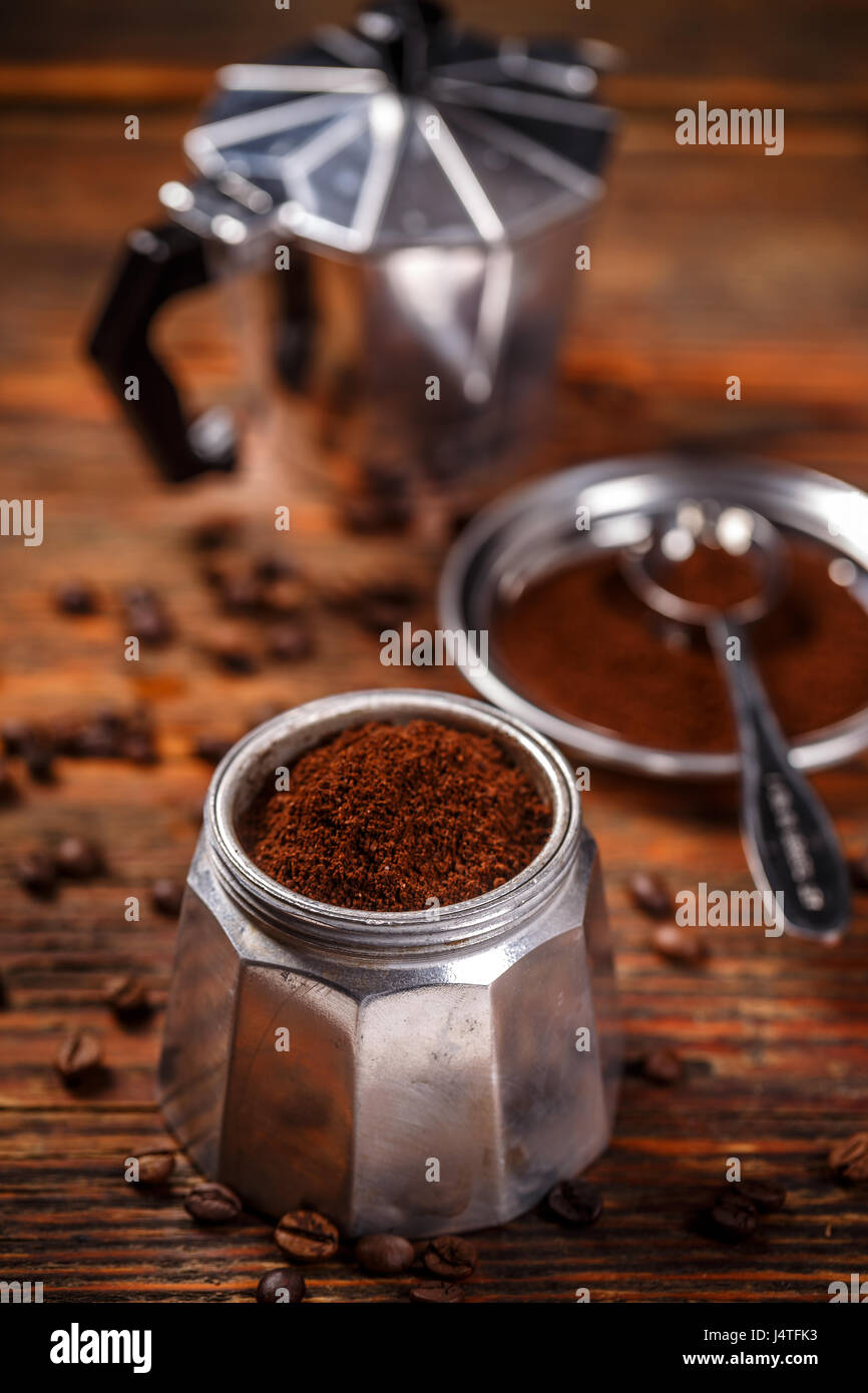 Old coffee maker in vintage style on wooden background Stock Photo - Alamy