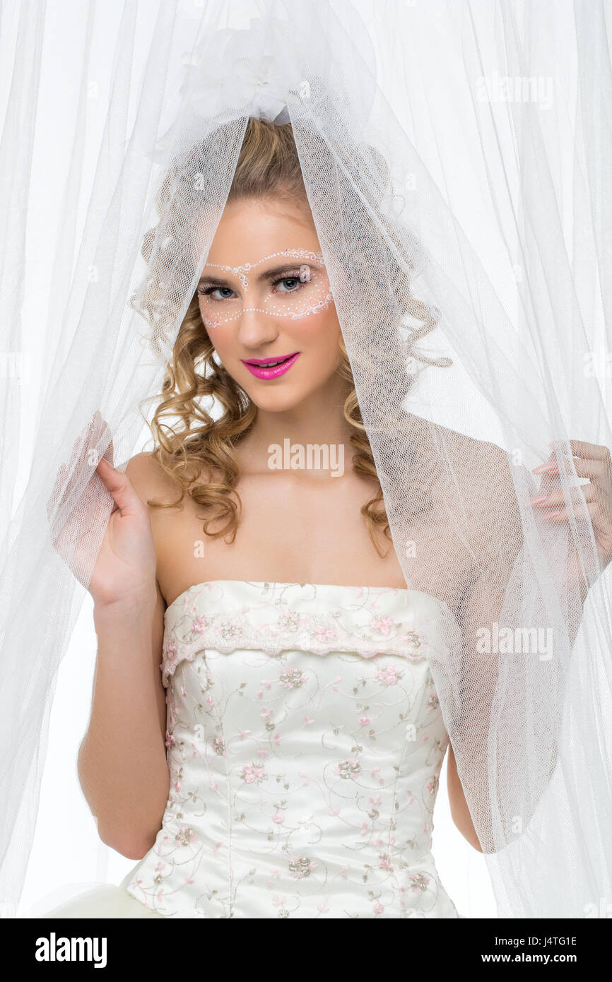 Bride with mask drawn on face Stock Photo - Alamy