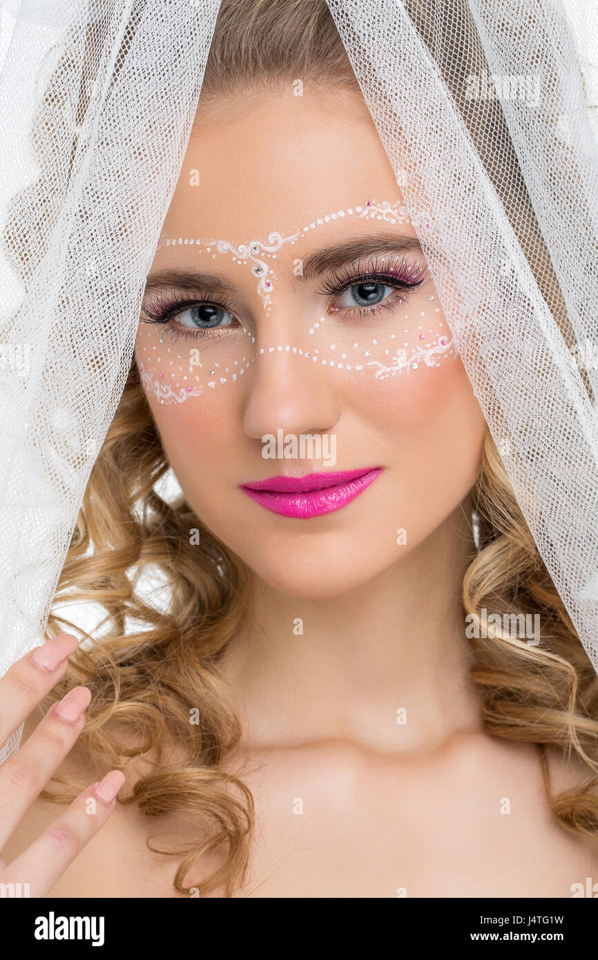 Bride with mask drawn on face Stock Photo - Alamy