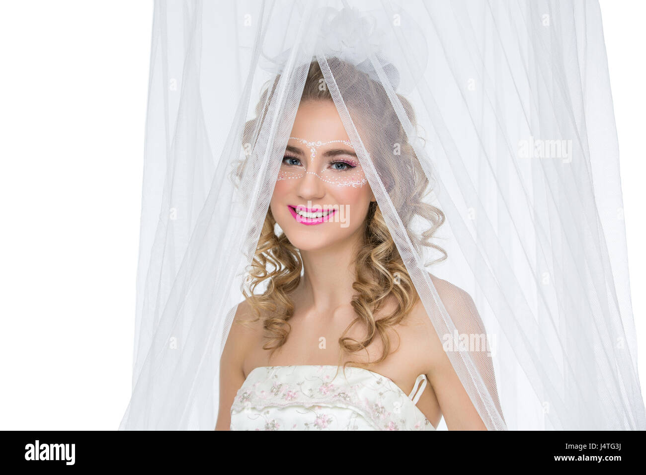 Bride with mask drawn on face Stock Photo - Alamy