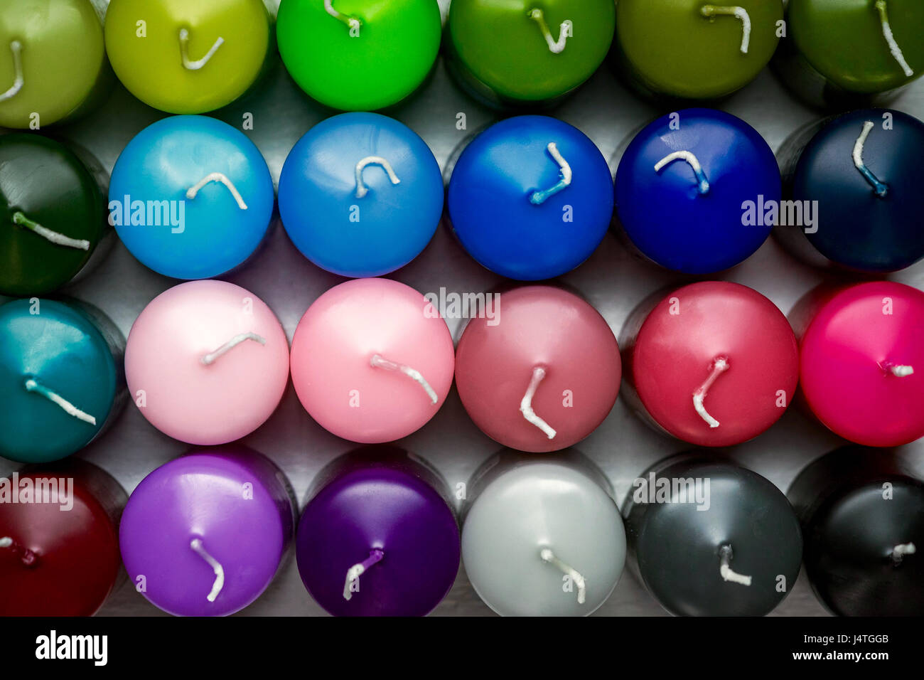 Twenty-four candles of different colors in one package Stock Photo - Alamy