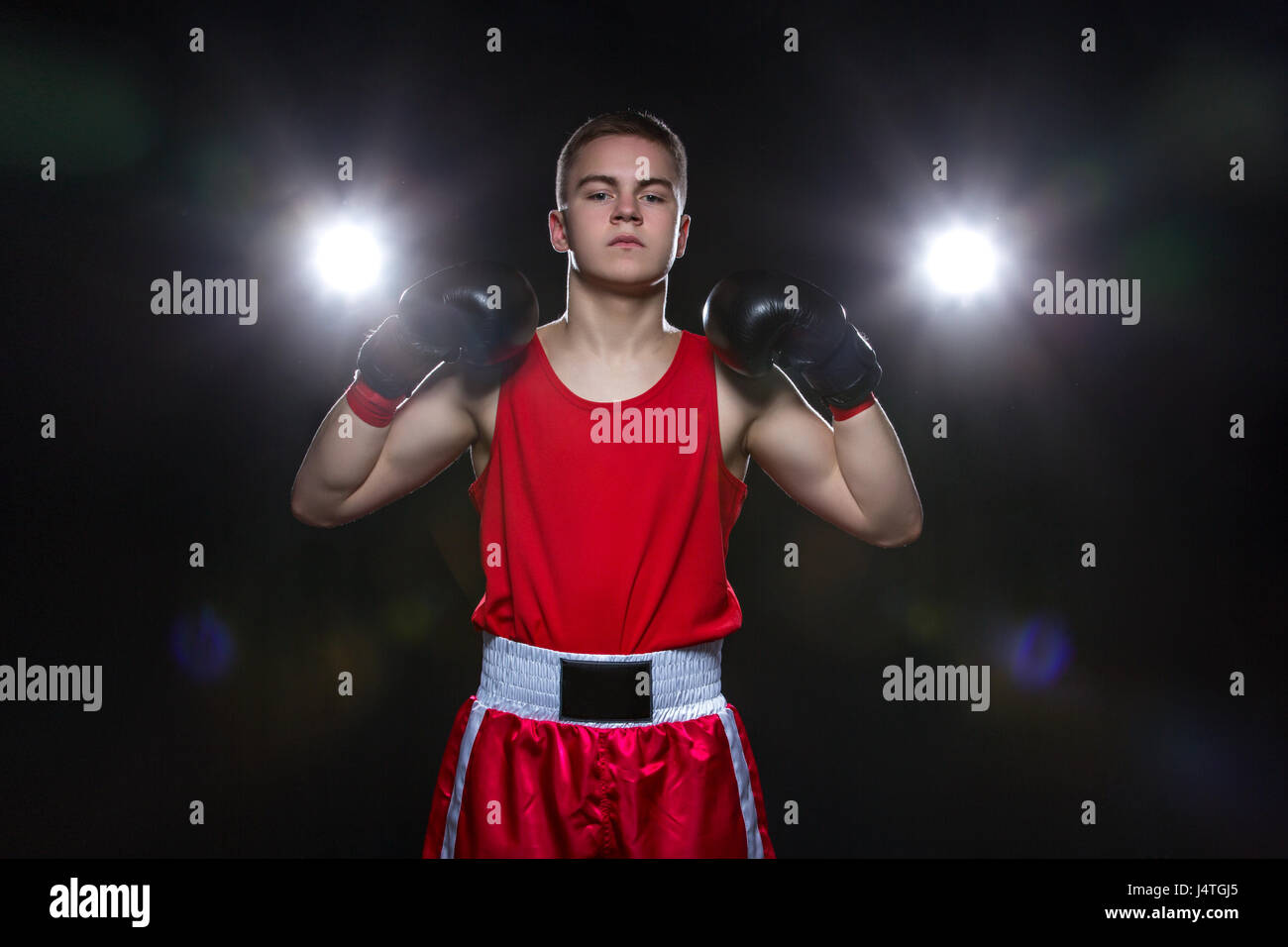 Young boxer in red form Stock Photo - Alamy
