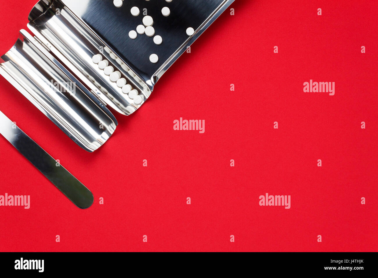 Top view medical concept the pills and tray pharmacy on red background ...