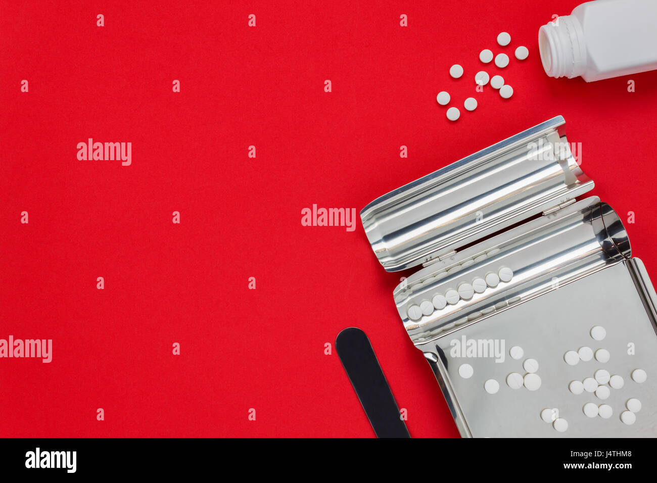Top view medical concept the pills and tray pharmacy on red background ...