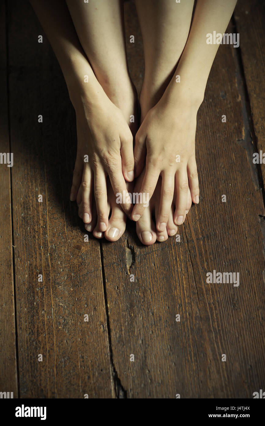 Hands and feet of woman on a wooden floor Stock Photo - Alamy