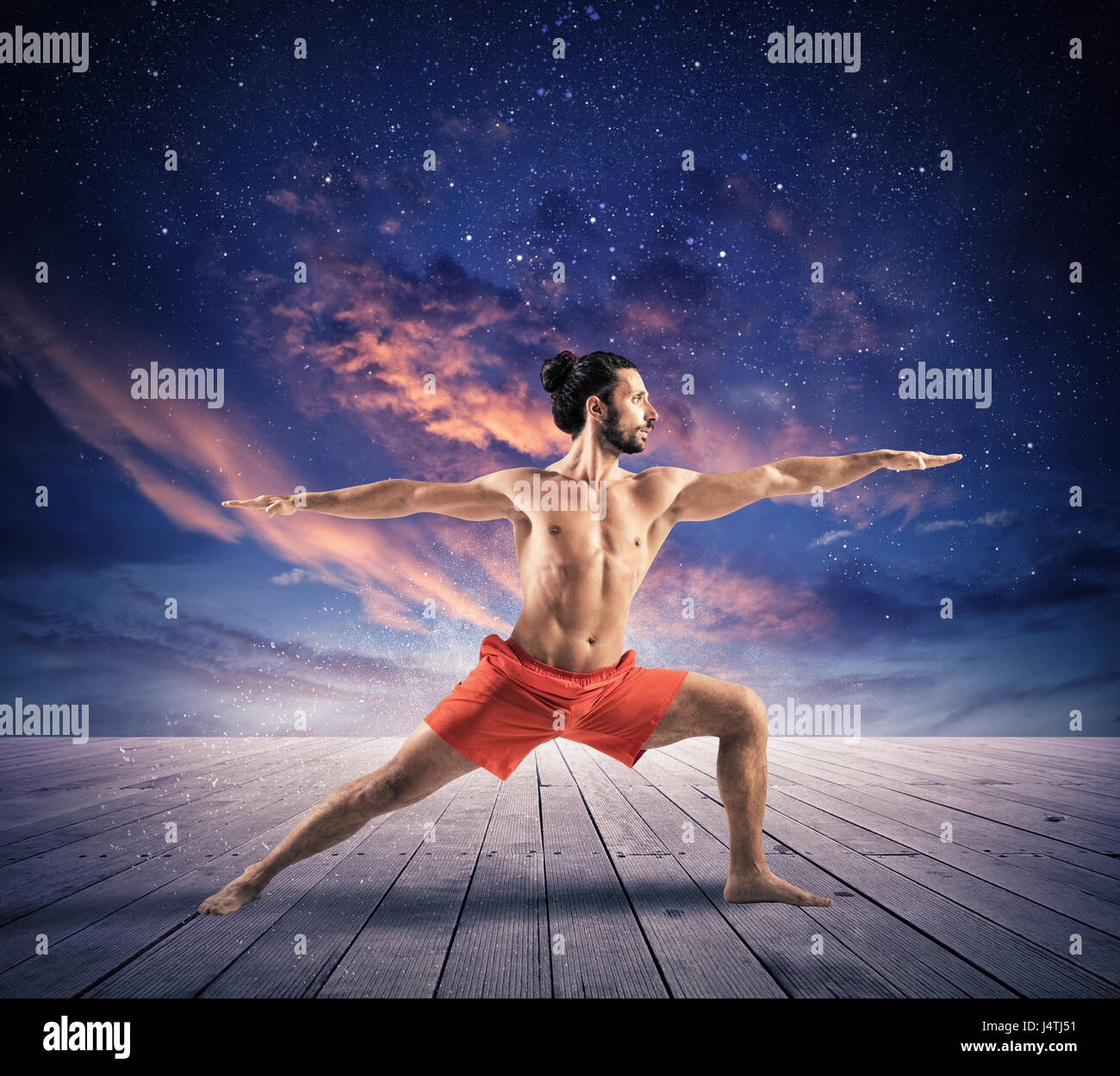Yoga under the sky with stars Stock Photo - Alamy