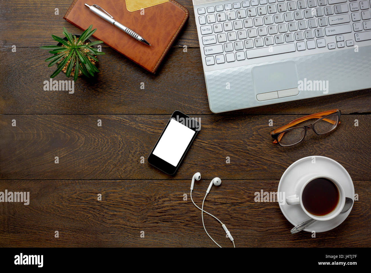 Top view accessories office desk the mobile phone,note paper,pencil ...