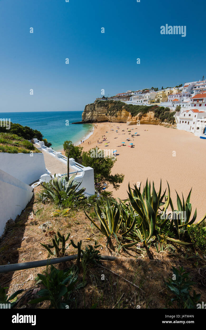 Tourist sunbatching at Carvoeiro beach, Portugal Stock Photo - Alamy