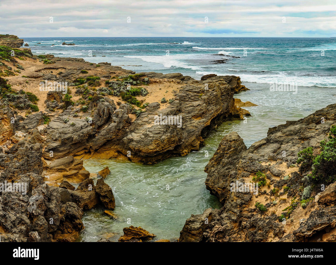 The sharp rocks on the Australian coast of the Pacific ocean Stock ...