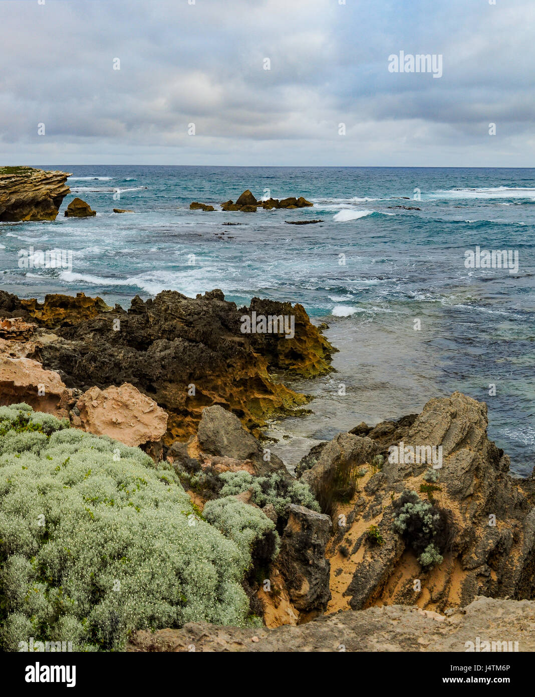 The sharp rocks on the Australian coast of the Pacific ocean Stock ...