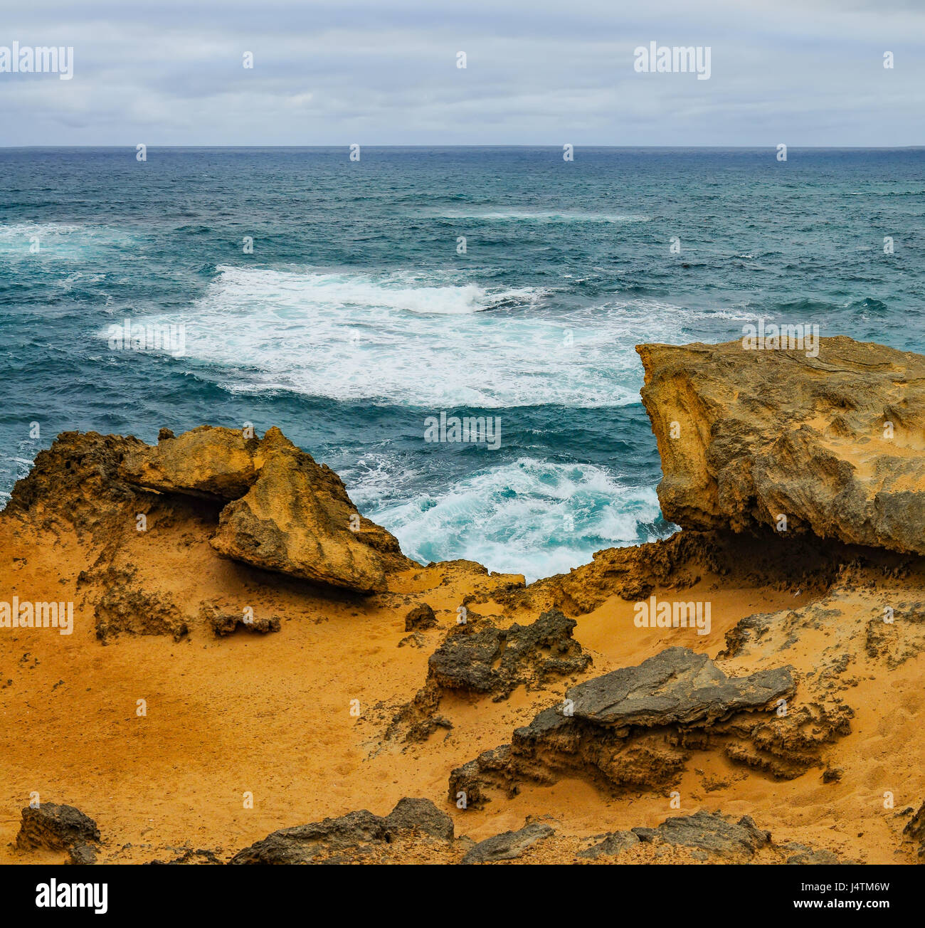 The sharp rocks on the Australian coast of the Pacific ocean Stock ...