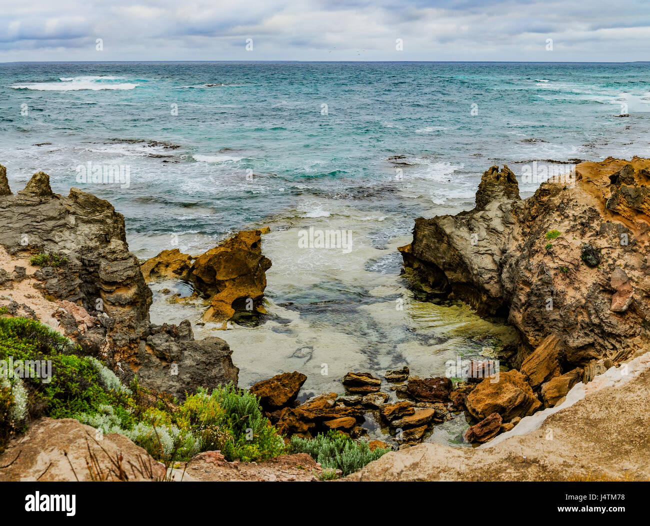 The sharp rocks on the Australian coast of the Pacific ocean Stock ...