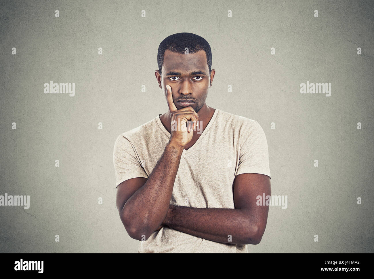 Serious handsome man with skeptical look Stock Photo - Alamy