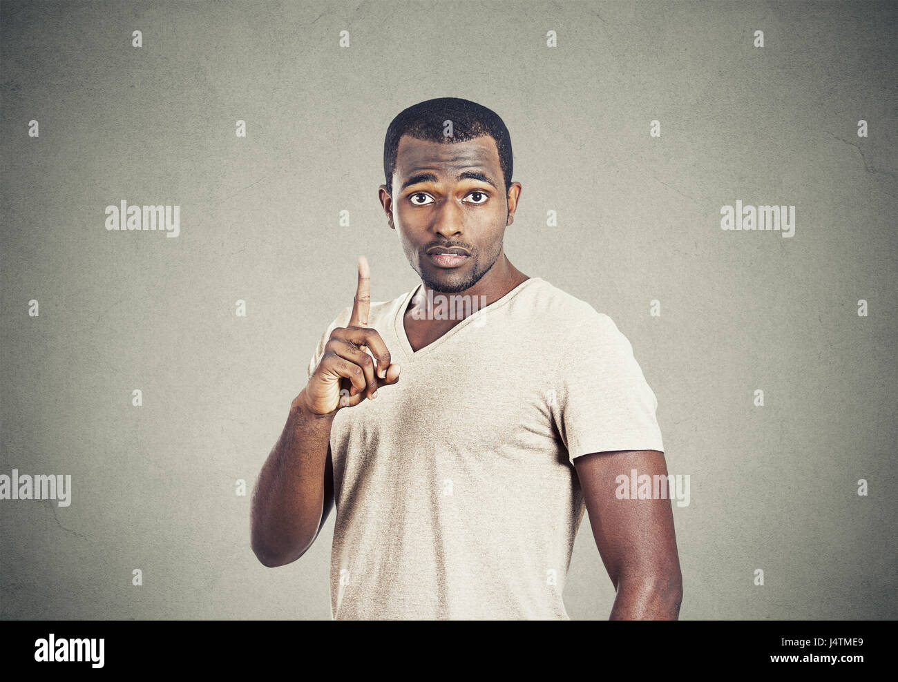 Closeup portrait young man pointing up having idea, solution, showing ...