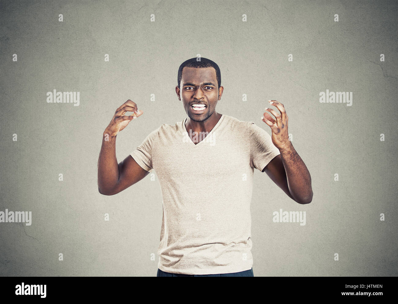 Portrait mad displeased pissed off angry man arms hands in air ...