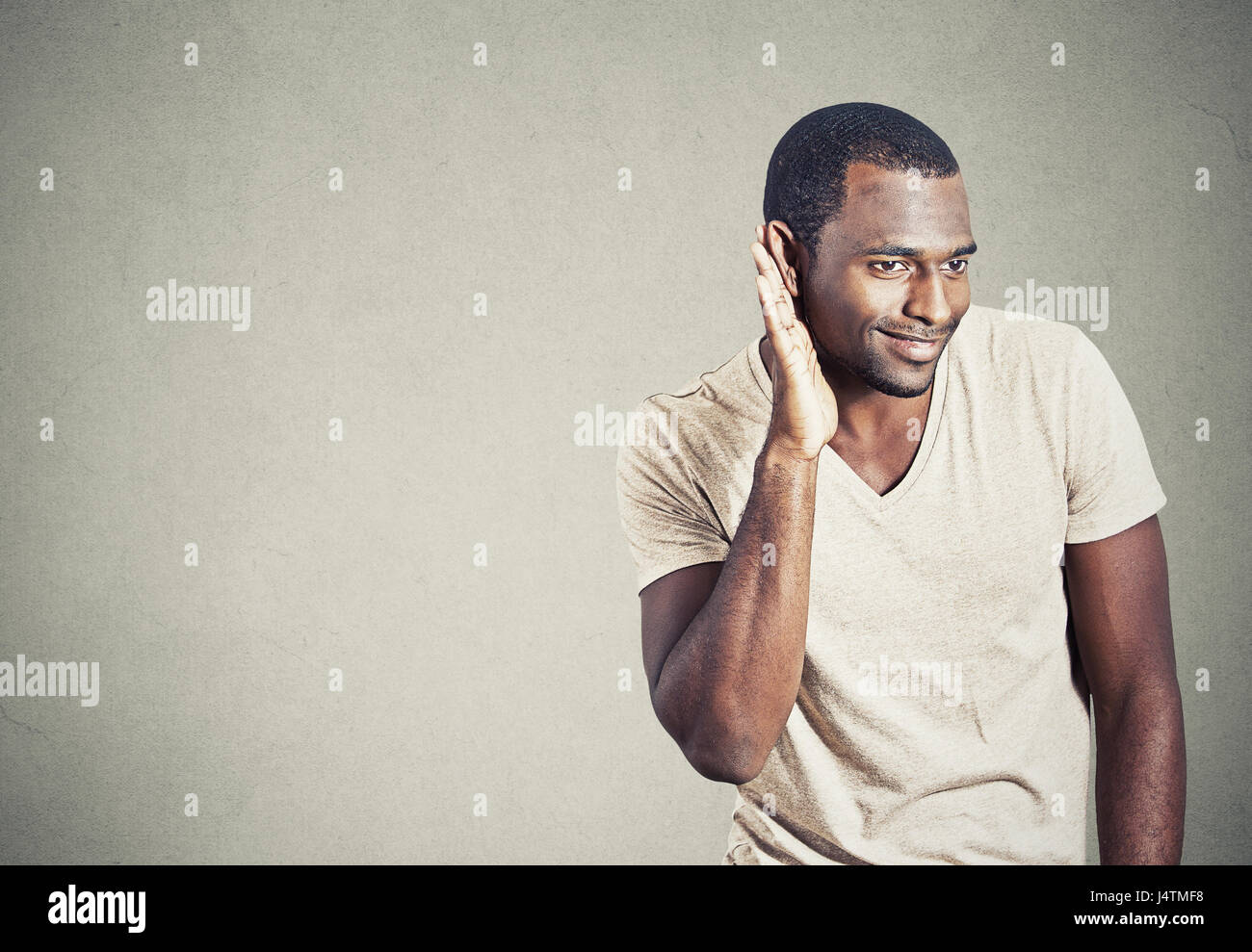 Curious young man eavesdropping listening in on conversation Stock ...