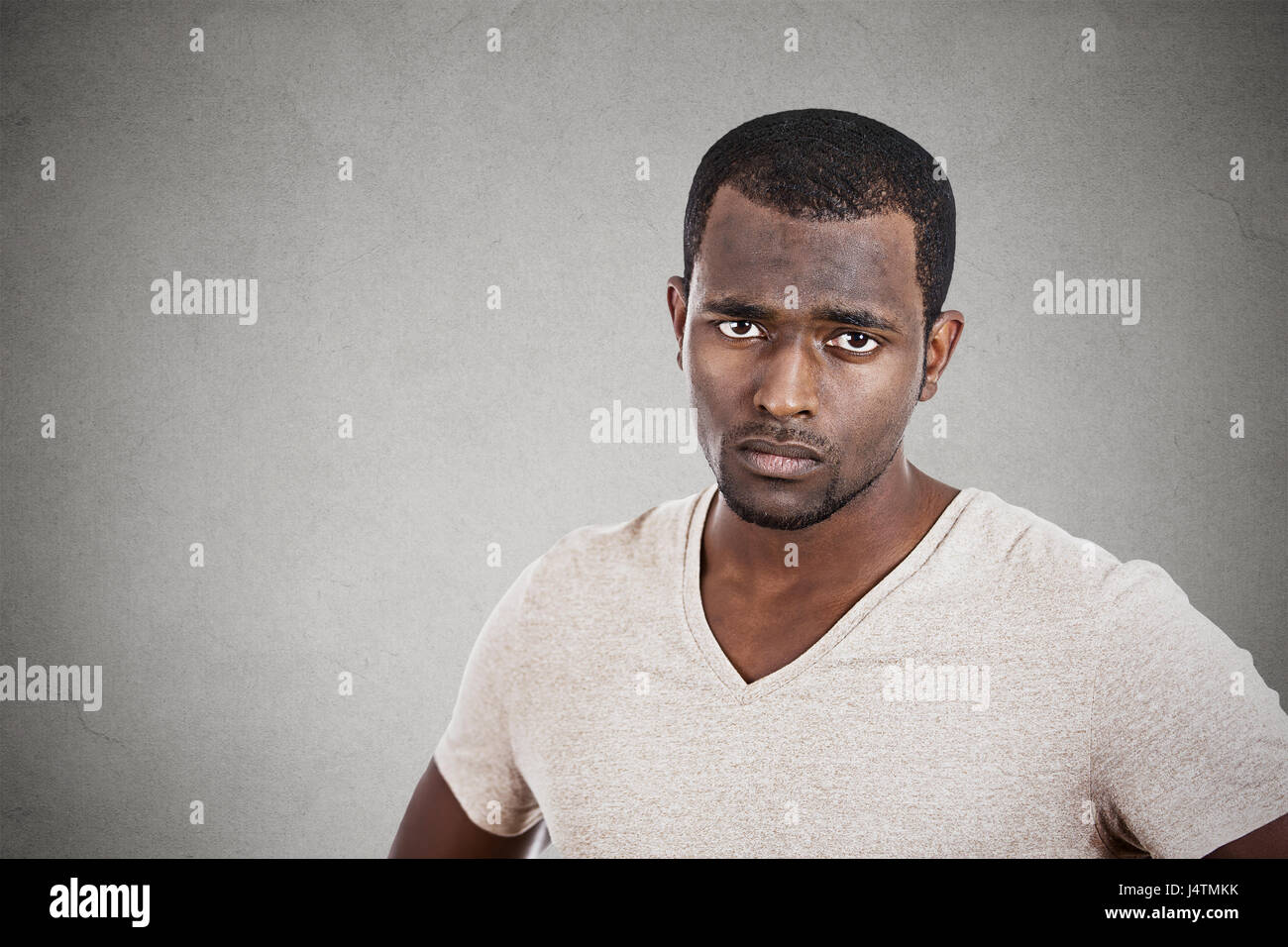 Annoyed unhappy young man looking at you camera Stock Photo - Alamy