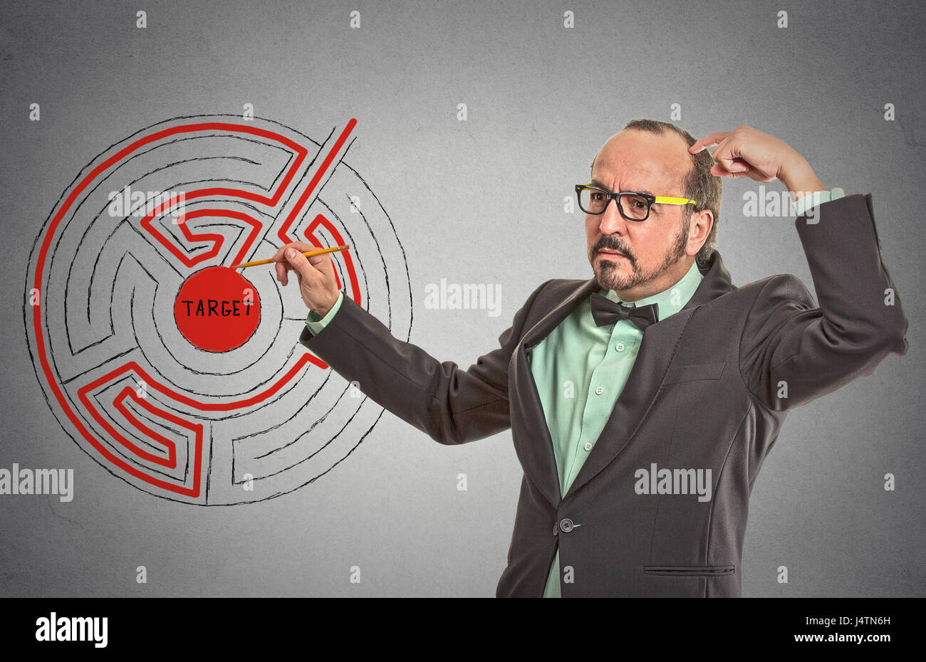 Target man labyrinth. Man drawing with pencil red path line through ...